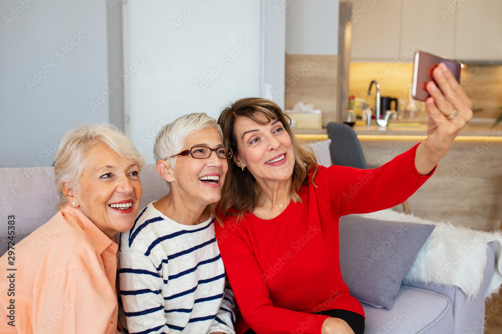 Beautiful senior women having fun taking selfies at home. Senior ...