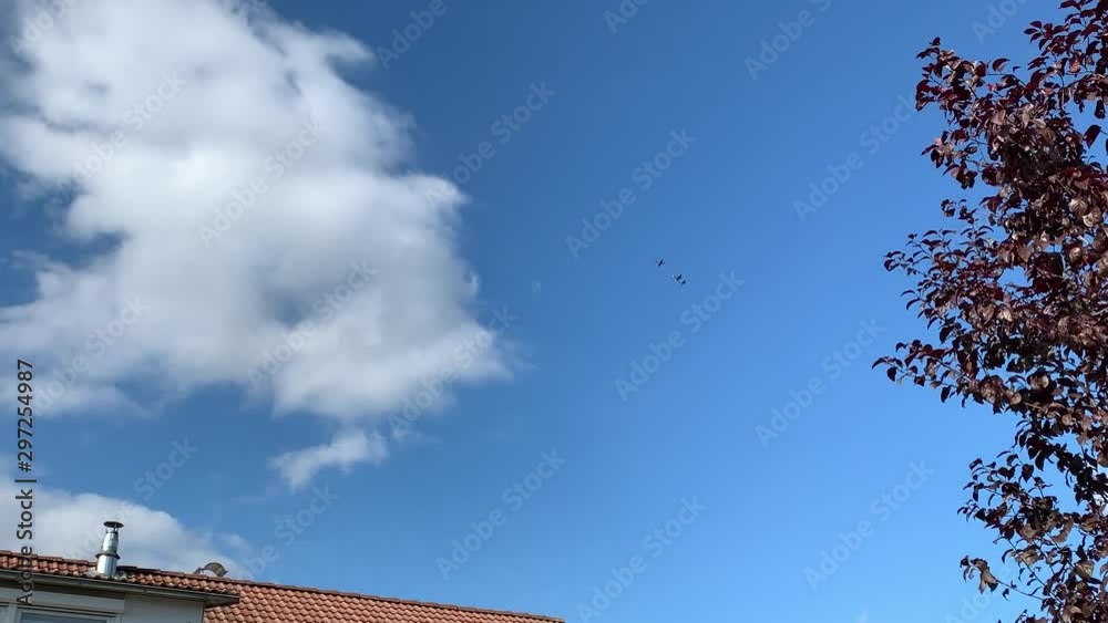 Three vintage airplanes flying in diagonal triple formation flight ...