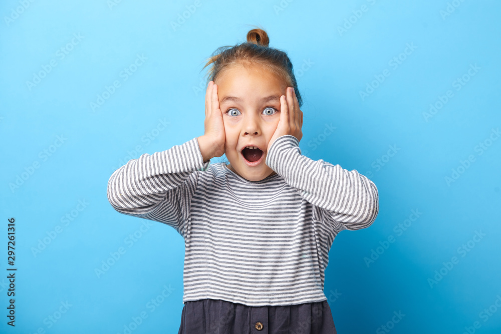 Surprised or shocked face, portrait of little girl holding hands on ...