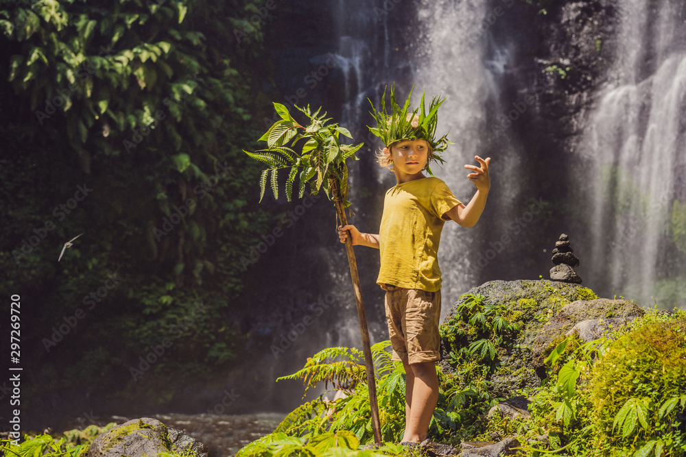 Cute boy depicts the king of the jungle against the backdrop of a ...