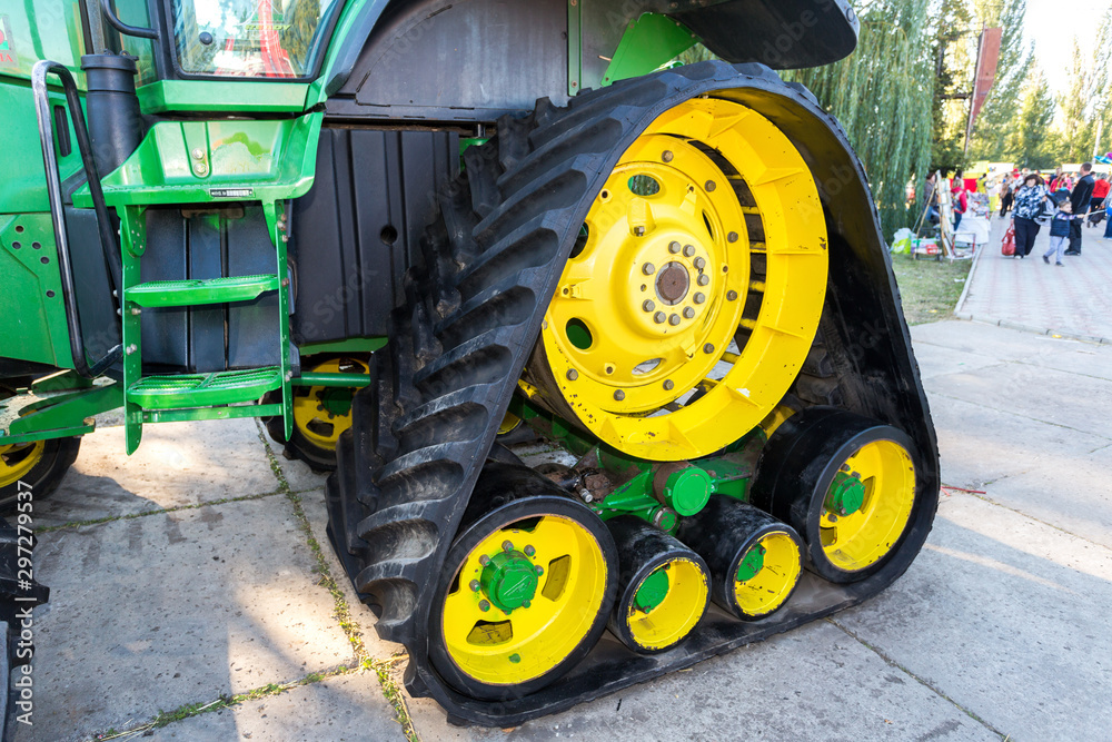 Rubber track of John Deere 7830 agricultural tractor on display at the ... Rubber track of John Deere 7830 agricultural tractor on display at the ...