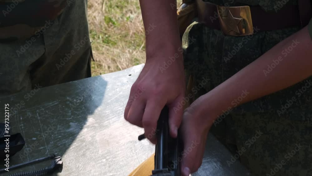 Assembly of a Kalashnikov assault rifle. Unlocking assault rifle ...