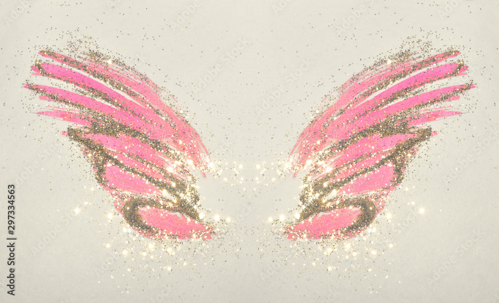 Golden glitter on abstract pink watercolor wings in vintage nostalgic ...