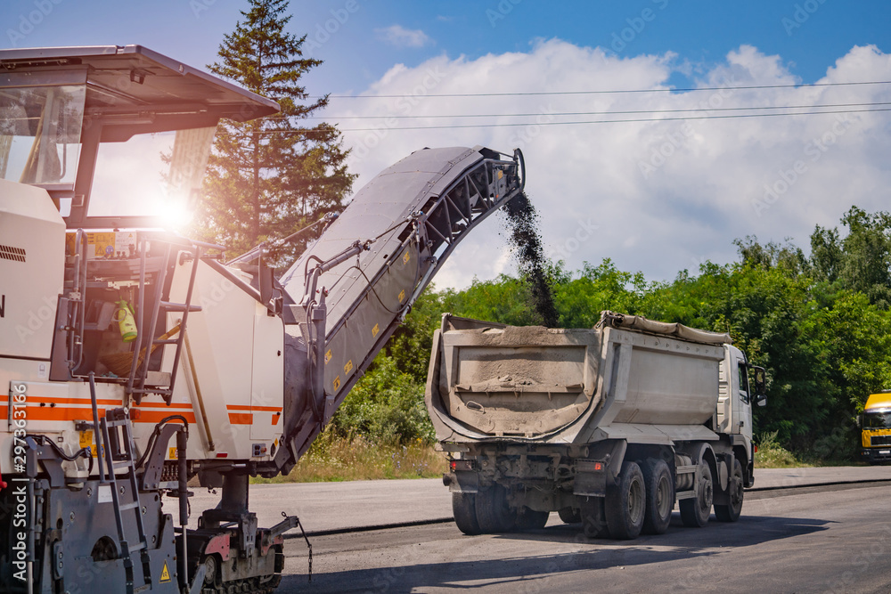 Road repair, highway reconstraction. Heavy special machines. Feeder ...