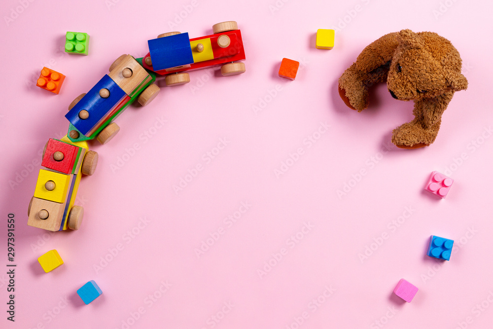 Baby kids toys background. Teddy bear, wooden train and colorful blocks ...