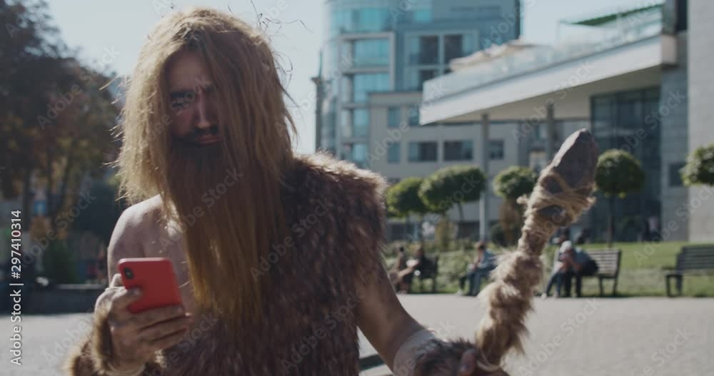 Vidéo Stock Serious neanderthal of hunter-gatherers discovering modern ...