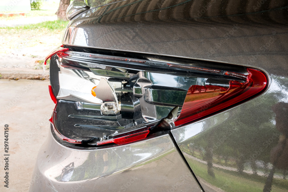Broken rear and tail light on a vehicle. Car crash damage and details ...
