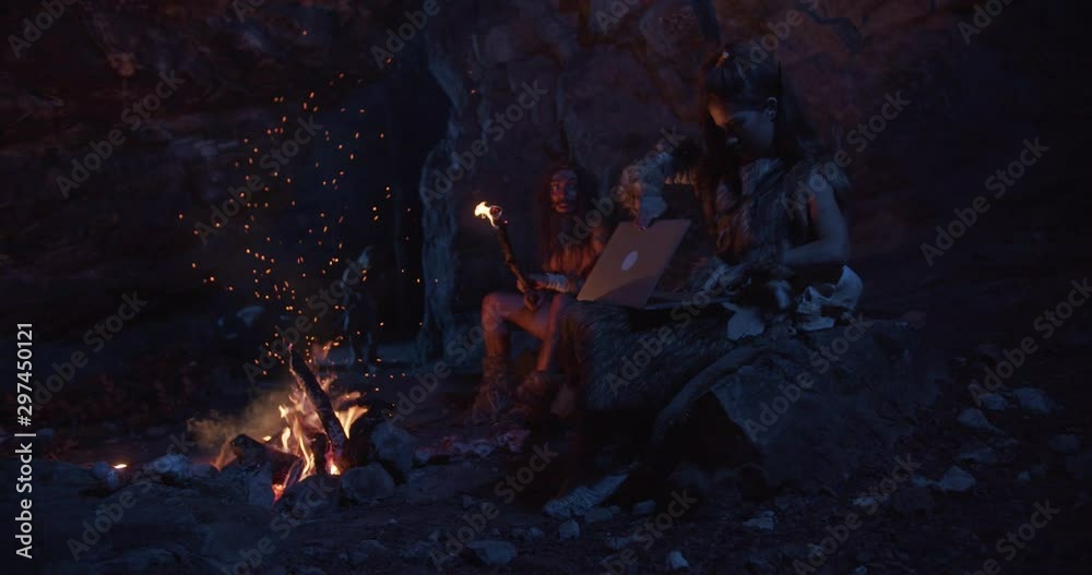At night tribe cavemen neanderthals wearing animal skin woman use ...