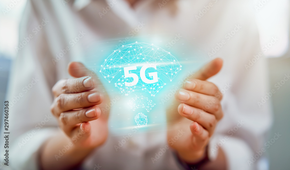 Foto de Concept of future technology 5G network, hands holding high ...