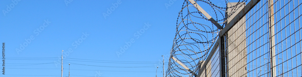 Barbed wire on the fence, concept for the protection of territory ...