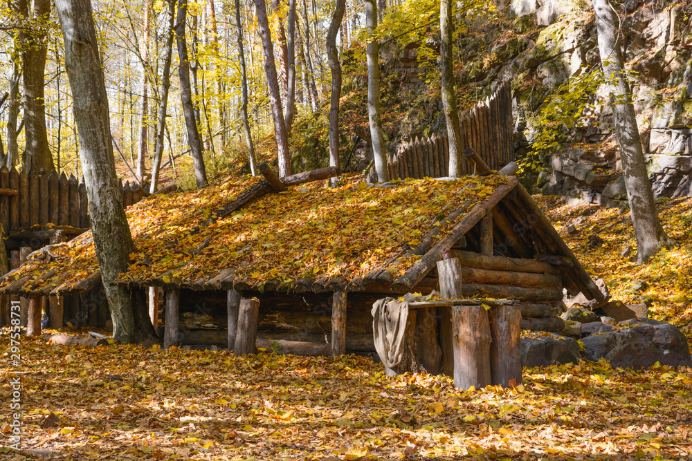 Dugout (or dug-out, pit-house, earth lodge, cellar dug) from logs in ...