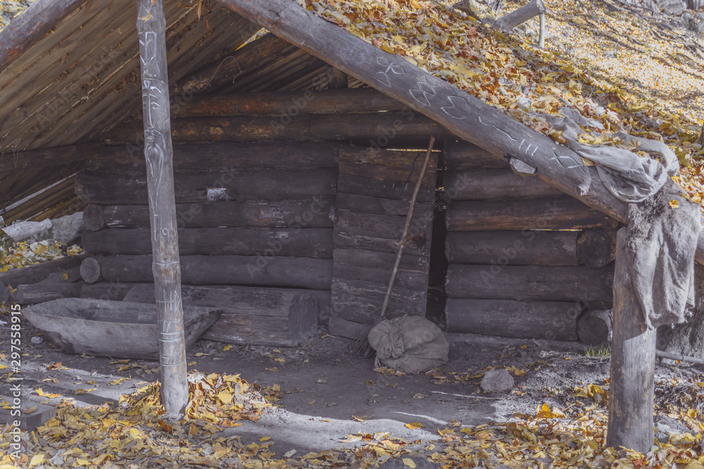 Dugout (or dug-out, pit-house, earth lodge, cellar dug) from logs in ...