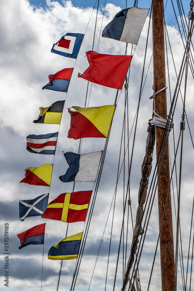 Nautical flags on the mast of a tall ship at Lunenburg, Nova Scotia ...