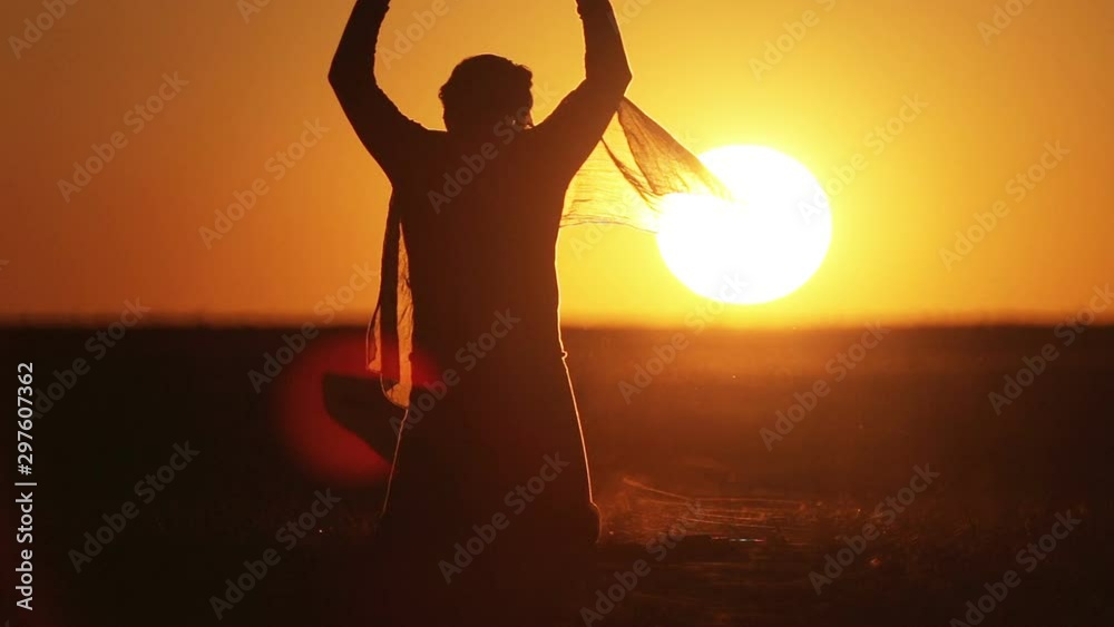 Islamic warrior with Kalashnikov at sunset day. Muslim fighter is ...