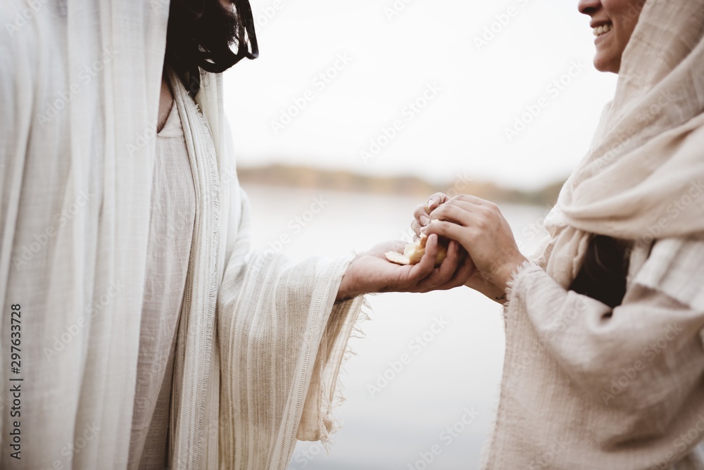 Scene - of Jesus Christ handing out bread with a blurred background ...