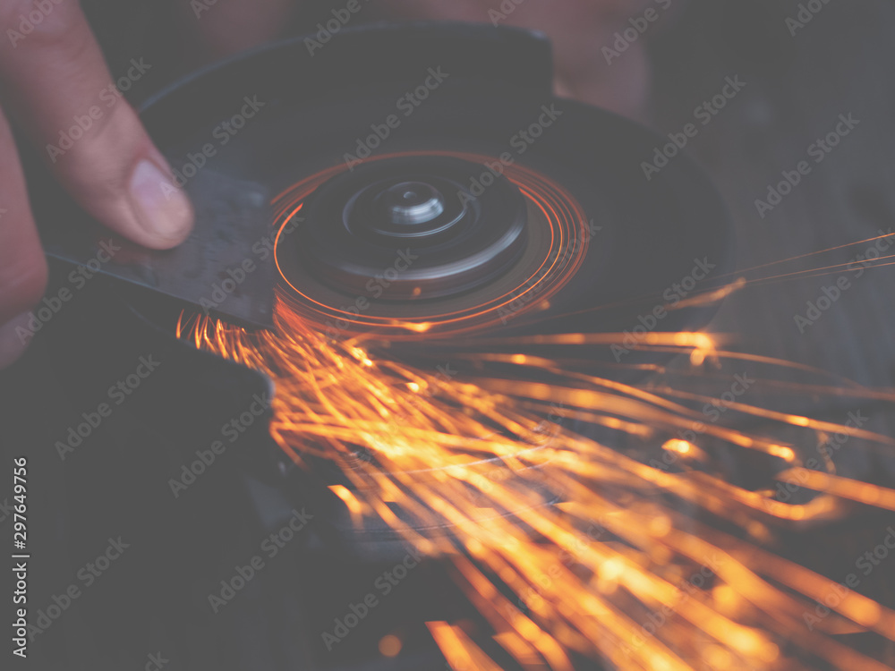 Man sharpen axe by grinder in the dark with sparks Stock Photo | Adobe ...