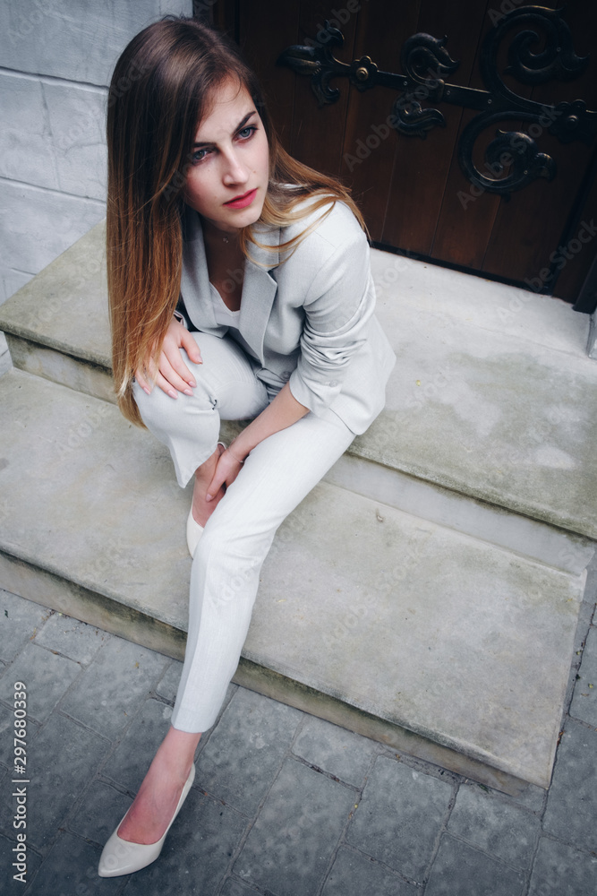 Above view of attractive girl with beautiful long hair, sitting on ...