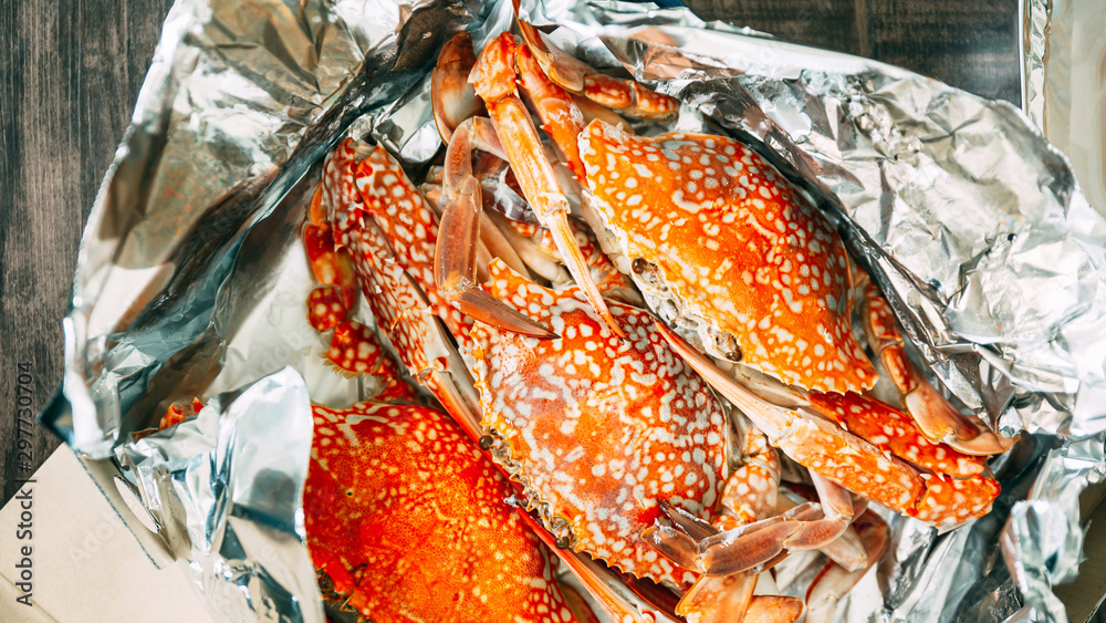Thai steamed Flower Crabs in the shell that wrap with foil paper. Thai ...
