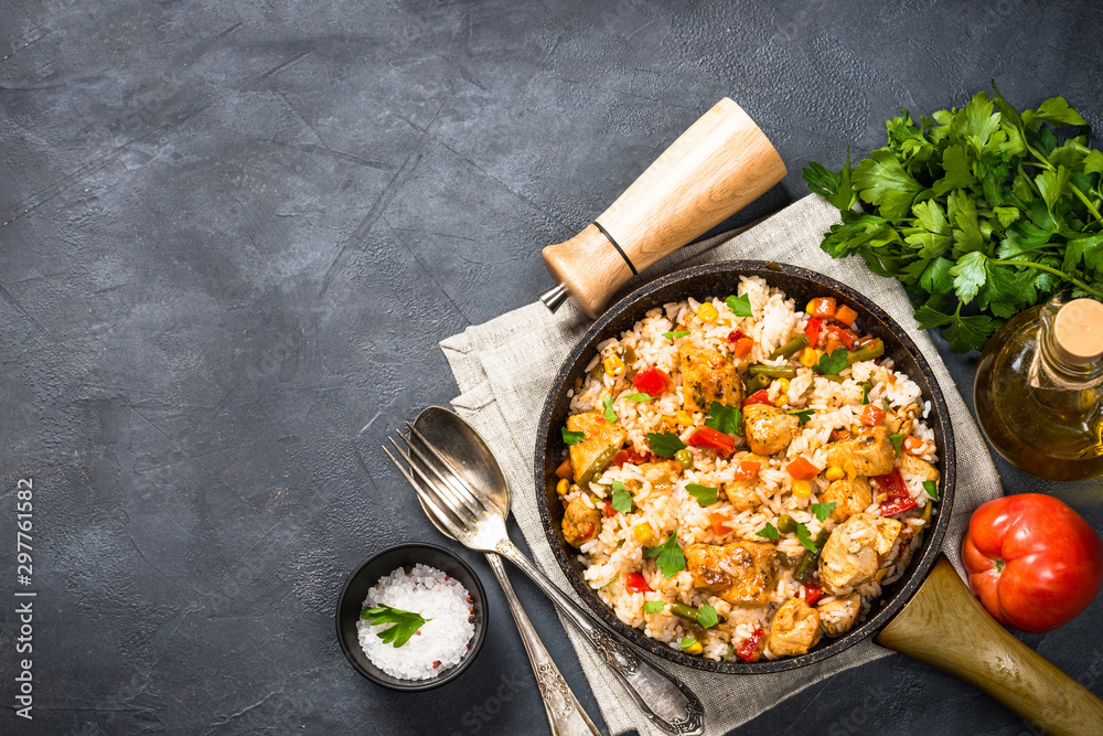 Rice with chicken and vegetables top view. Stock Photo | Adobe Stock