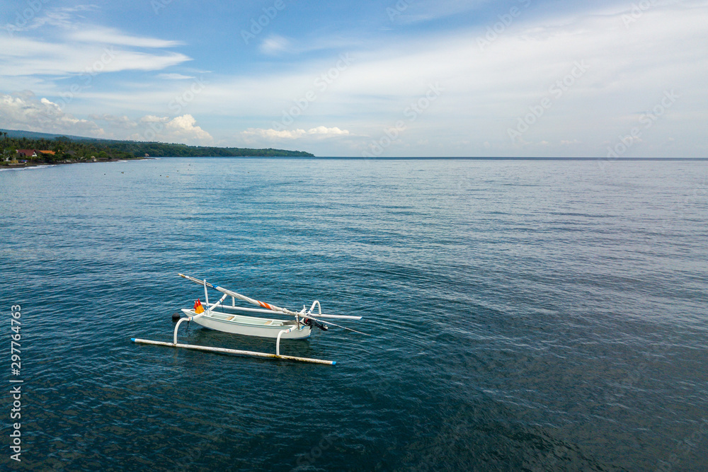 Aerial view of a traditional fishing boat called jukung in Bali ...