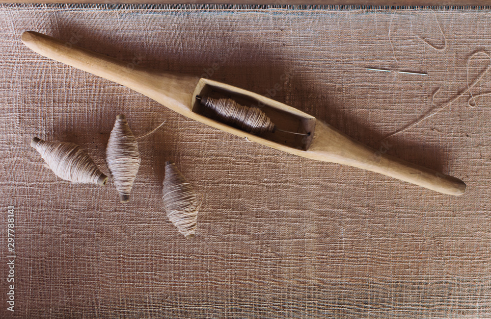 Wooden Shuttle and Spool on cotton thread in Loom. Old shuttle loom ...