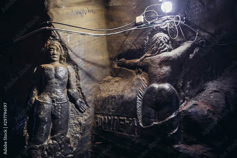 Statues of Adam and Eve in one of the corridors of Cacica Salt Mine in ...