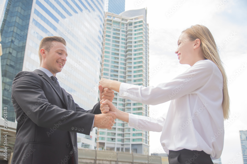 business people showing unity with their hands together,Office building ...