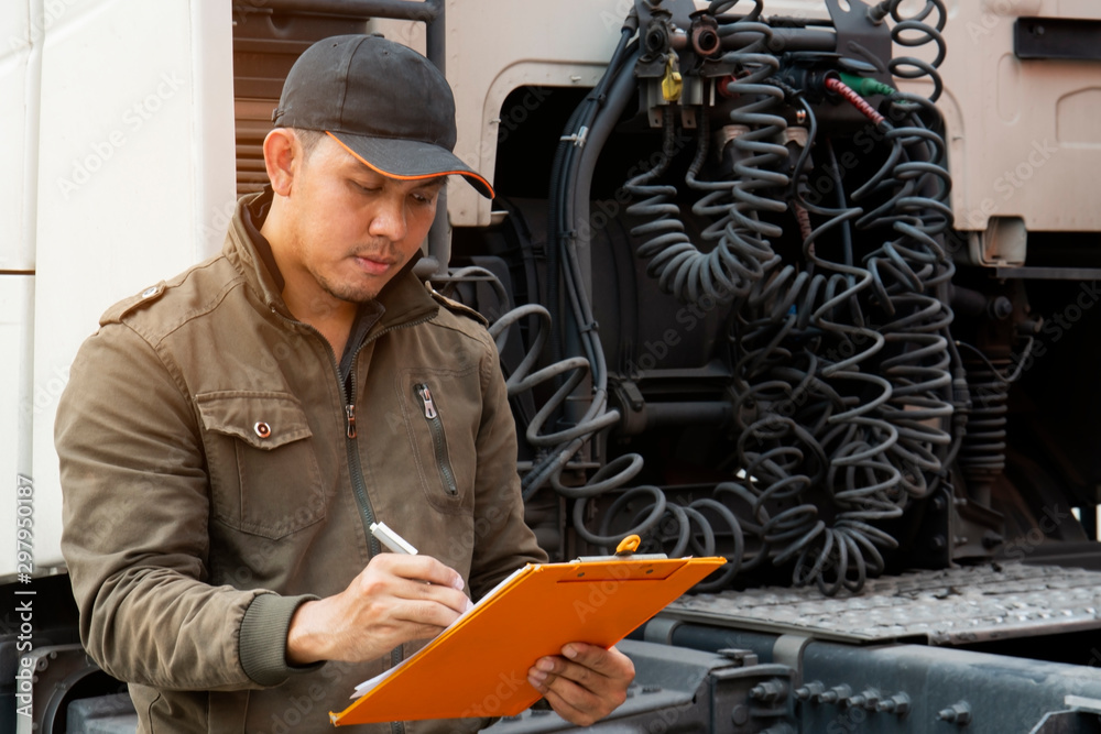 Asian Truck Drivers is Checking the Truck's Safety Maintenance ...
