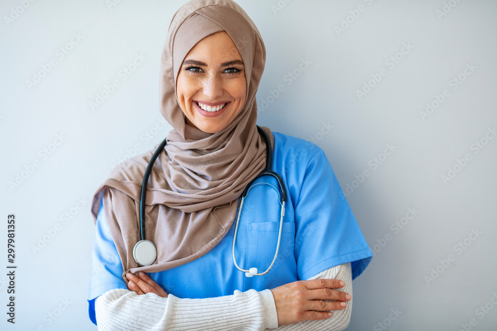 Confident Muslim female doctor standing inside hospital. Portrait of ...
