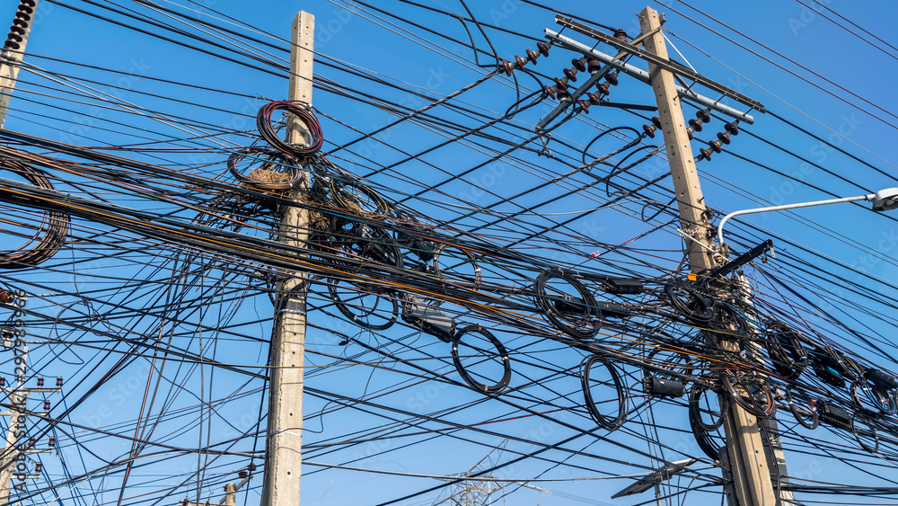 Untidy electricity wires and cable network lines on a pole. Stock Photo ...