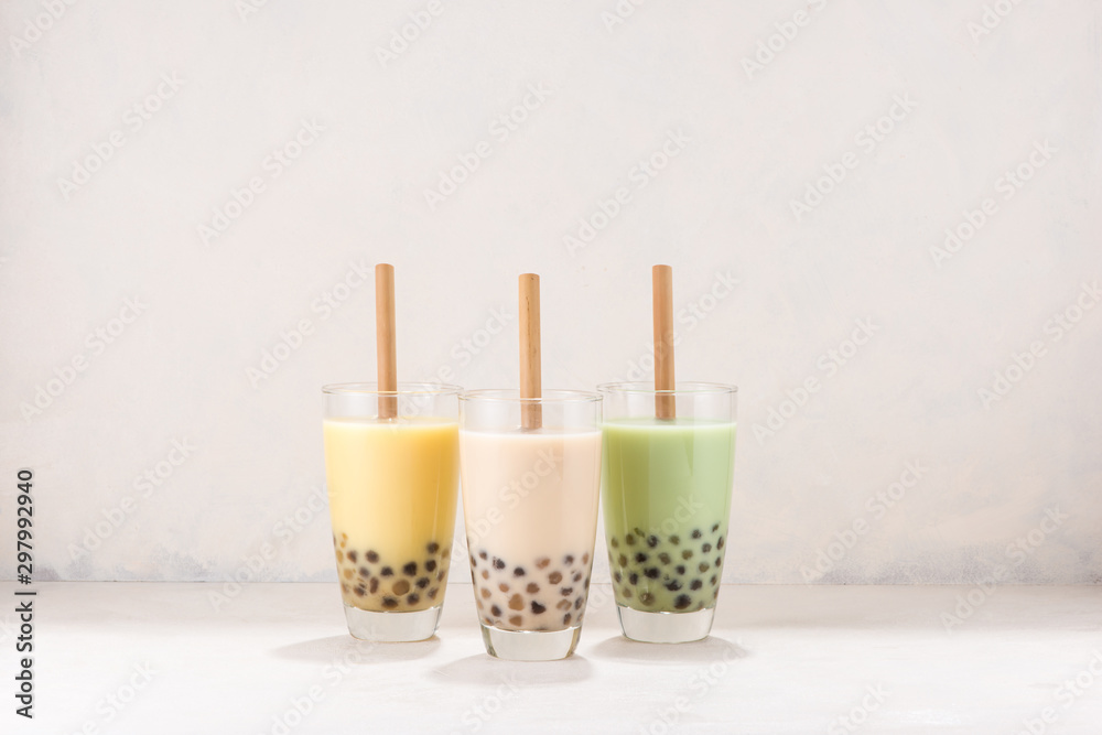 Various Bubble Tea in glasses with drink straws on white background ...