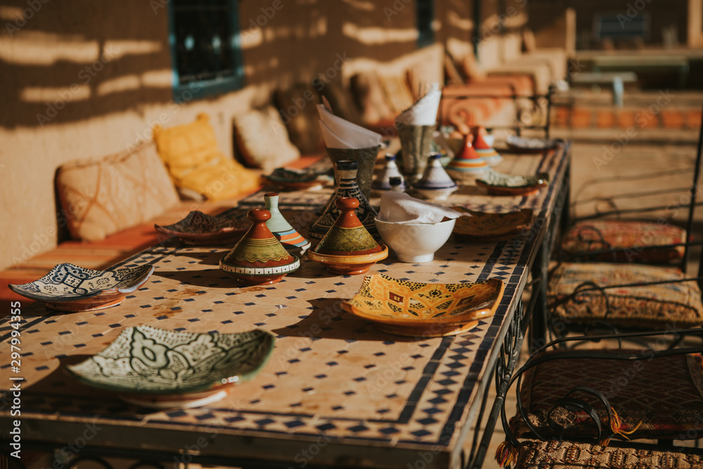 Moroccan meal table settings with ceramic tajines and dishes. Stock ...