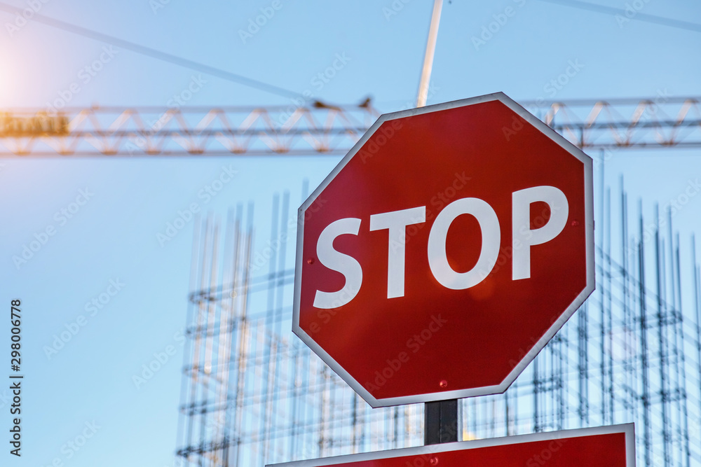 Stop Sign And Blue Sky.Work in progress. Roadworks, road signs. Men at ...