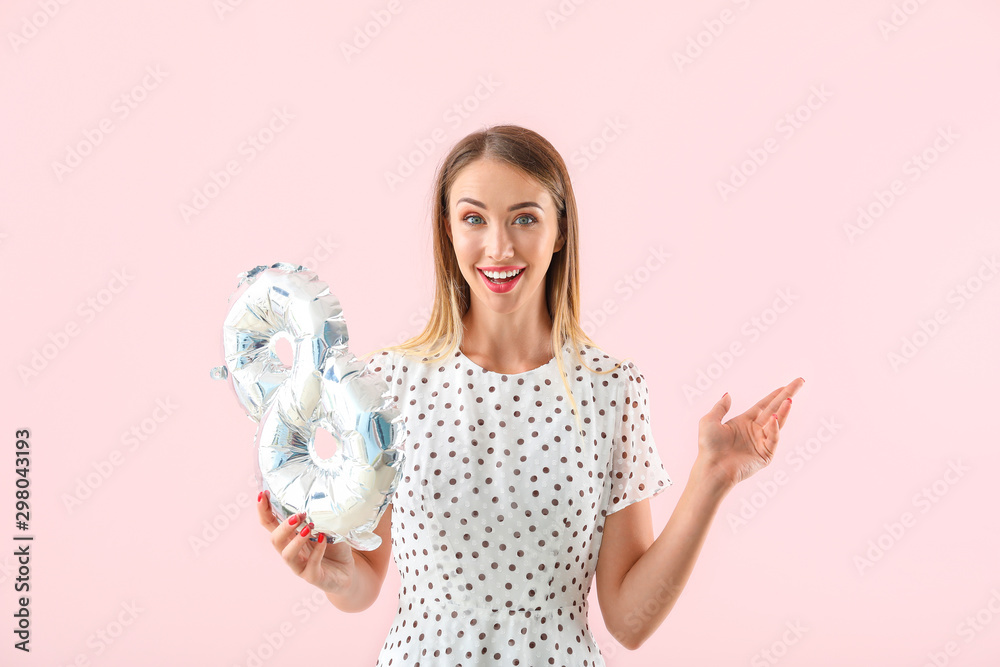 Beautiful young woman with figure 8 on color background. International ...