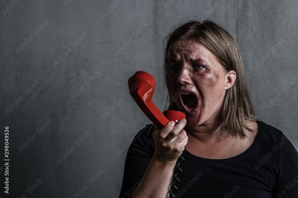 Angry young woman victim of domestic violence and abuse, screaming in ...