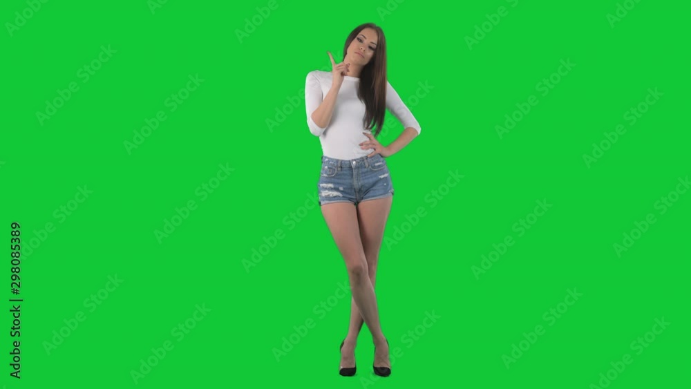 Young displeased strict authoritative girl scolding and shaking finger ...