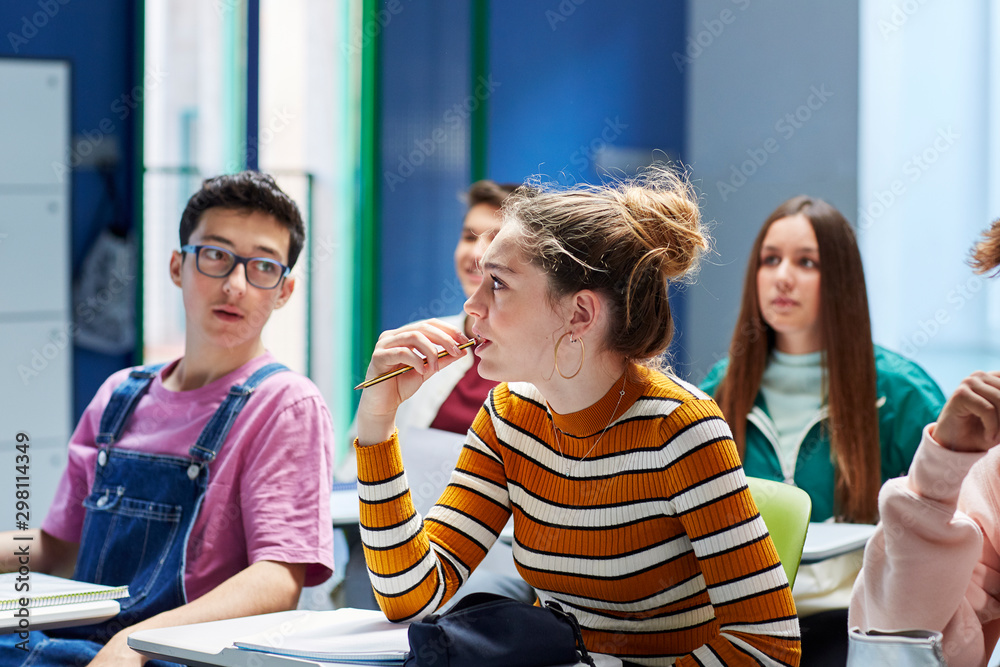 Teenage students listening in the classroom Stock Photo | Adobe Stock
