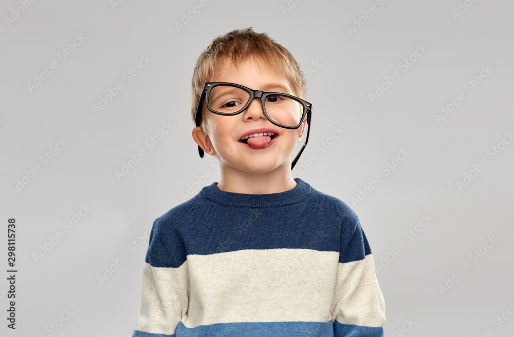 school, education and vision concept - portrait of smiling little boy ...