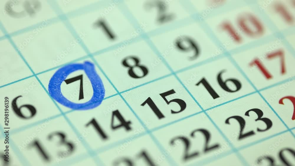 7th – seventh day of the month. The woman marks the calendar date with ...