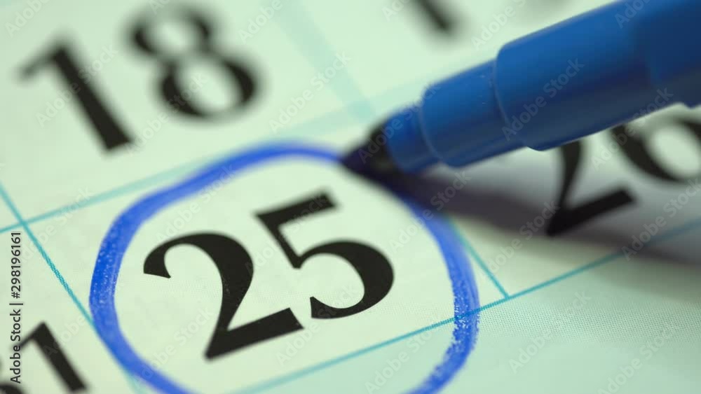 25th – twenty-fifth day of the month. The woman marks the calendar date ...