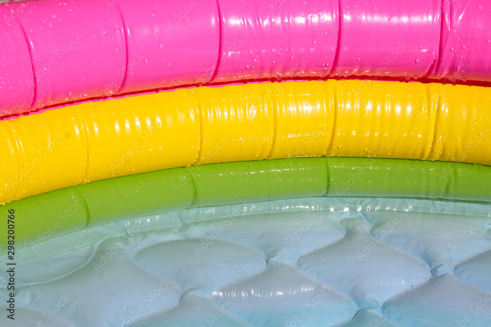 Bright blue inflatable paddling pool surface with water ripples. Summer ...