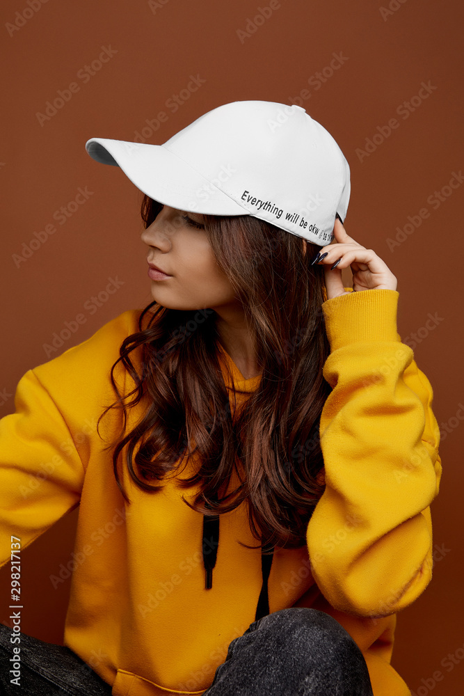 Profile photo of brunette European lady in a white baseball cap with ...