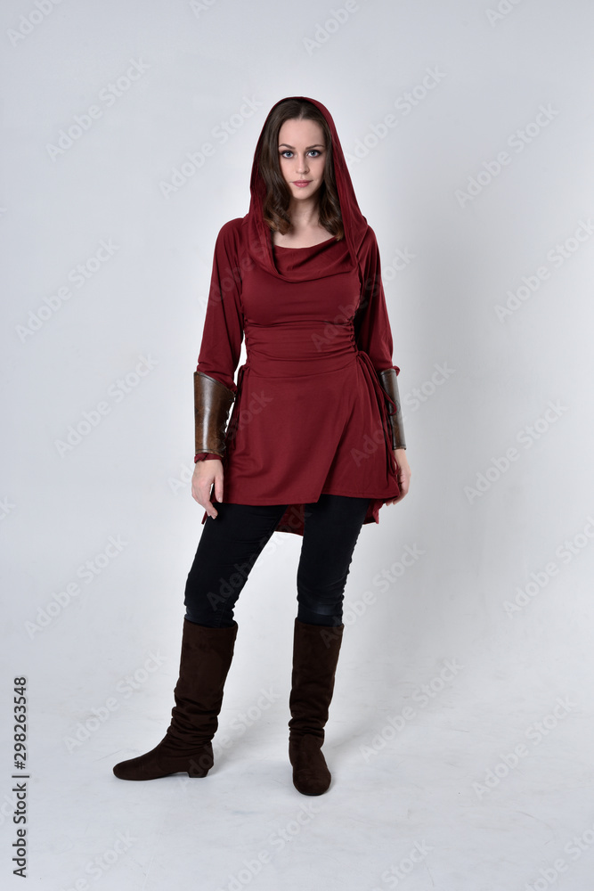 full length portrait of a brunette girl wearing a red fantasy tunic ...