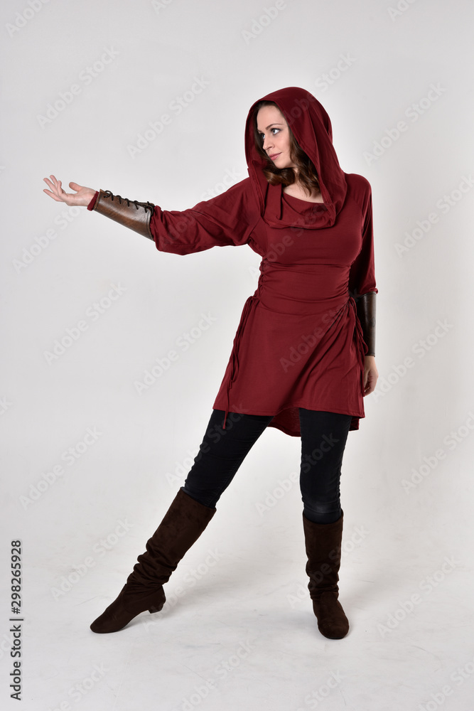 full length portrait of a brunette girl wearing a red fantasy tunic ...