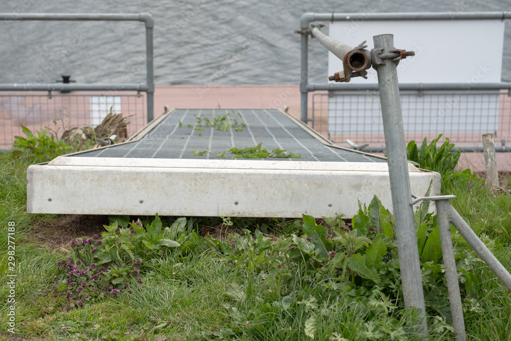 Detailed view of a boat yard's slip way seen leading to a floating ...
