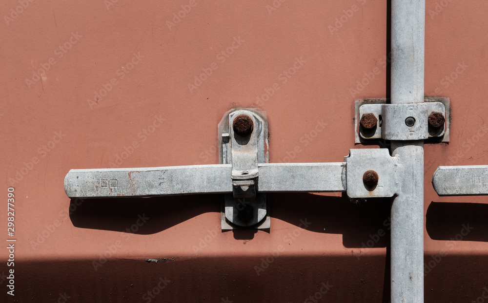Detail of a typical shipping container locking system, showing the ...