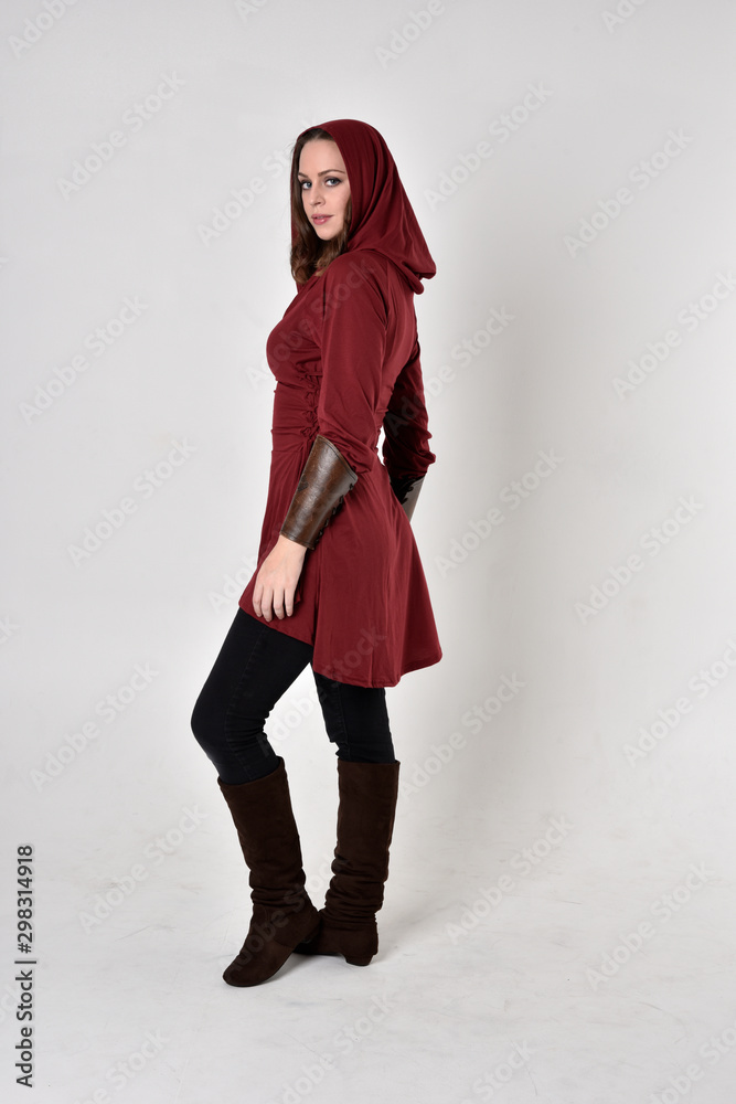 full length portrait of a brunette girl wearing a red fantasy tunic ...