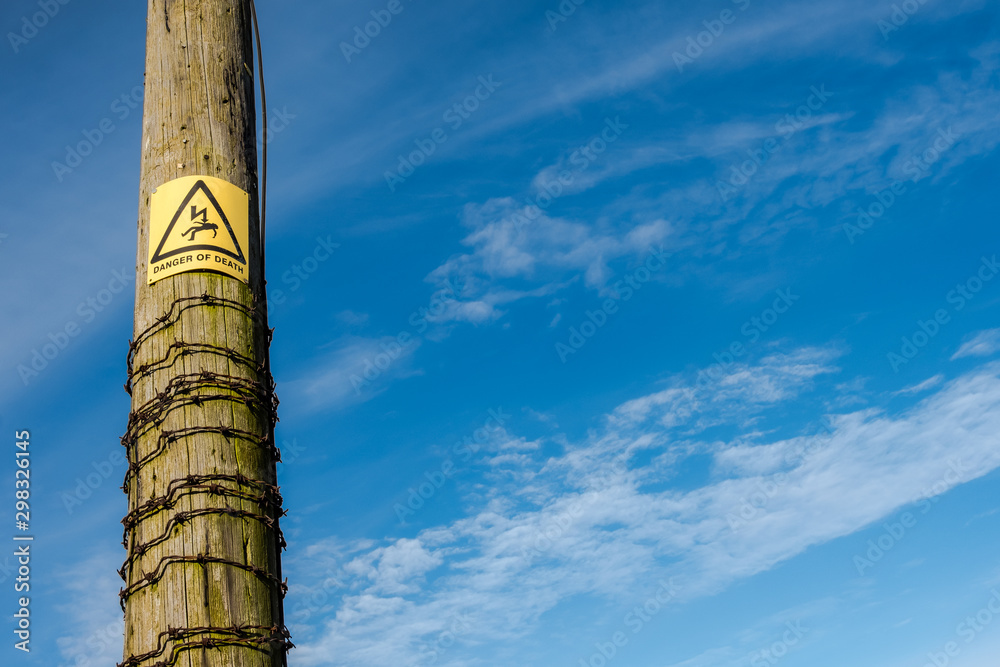 Foto de Abstract view of an electricity wooden pole showing both a ...