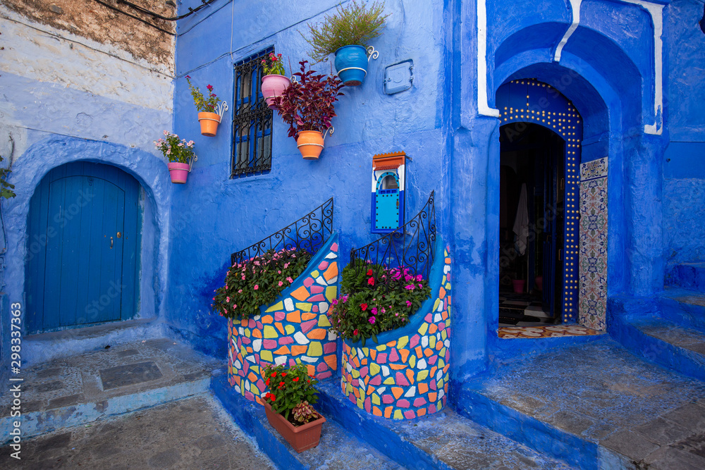 Narrow streets and blue painted houses of Chefchaouen city, Morocco ...