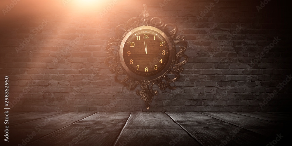 Dark room, spotlight, rays. Old clock in a metal frame. Old brick wall ...
